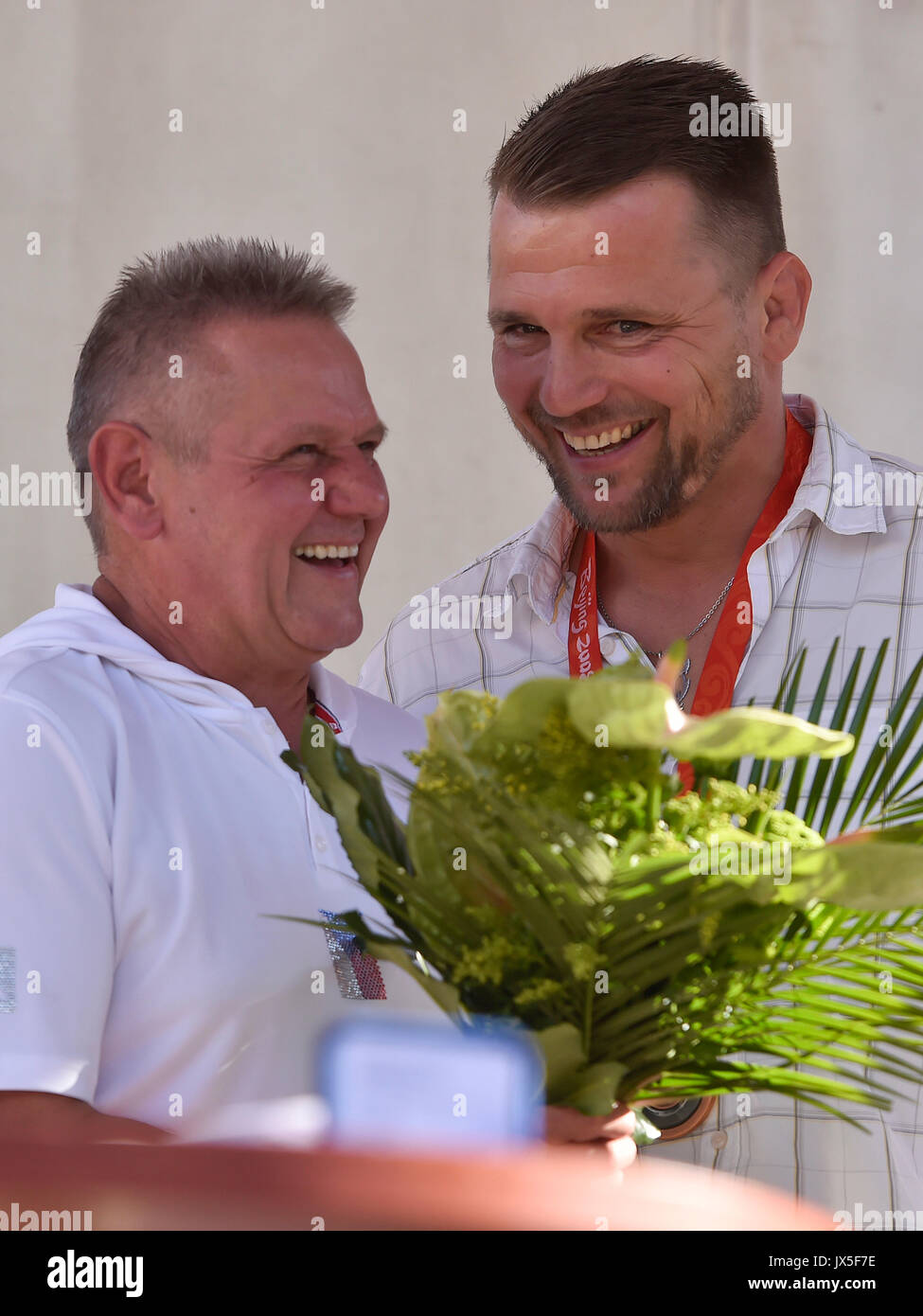 Havlickuv Brod, Czech Republic. 14th Aug, 2017. Czech wrestler Marek Svec (right) receives a ...