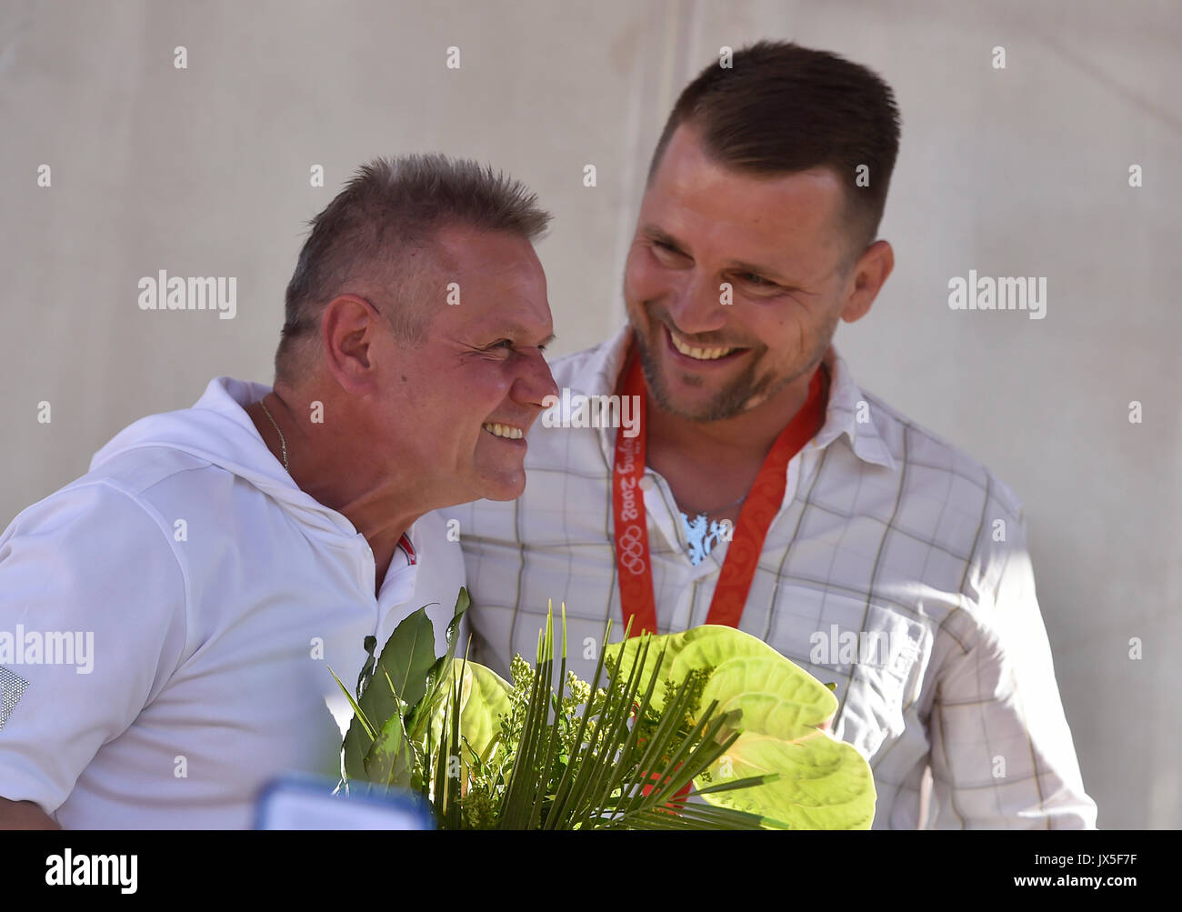 Havlickuv Brod, Czech Republic. 14th Aug, 2017. Czech wrestler Marek Svec (right) receives a ...