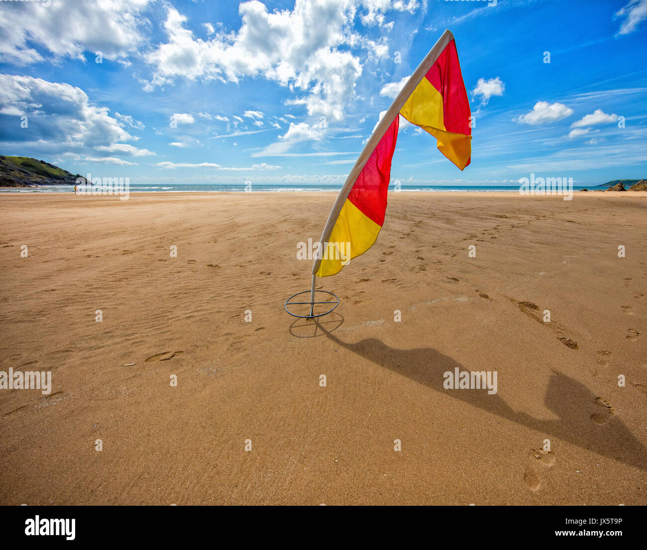 Warning flag at Three Cliffs Bay on the Gower coast of South Wales UK ...