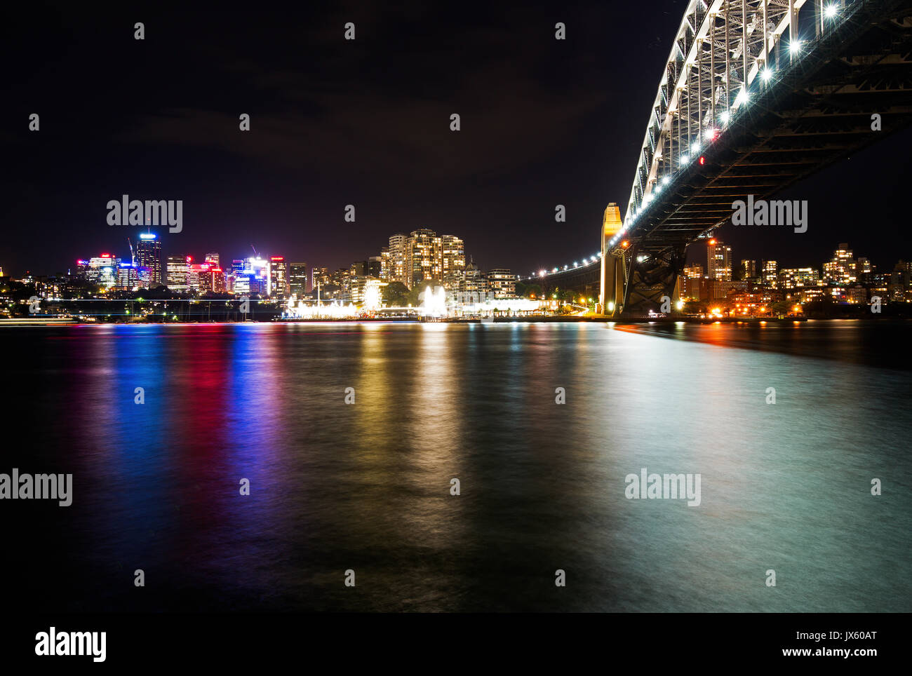 Colorful light reflection at Sydney Harbour Bridge at Night from ...