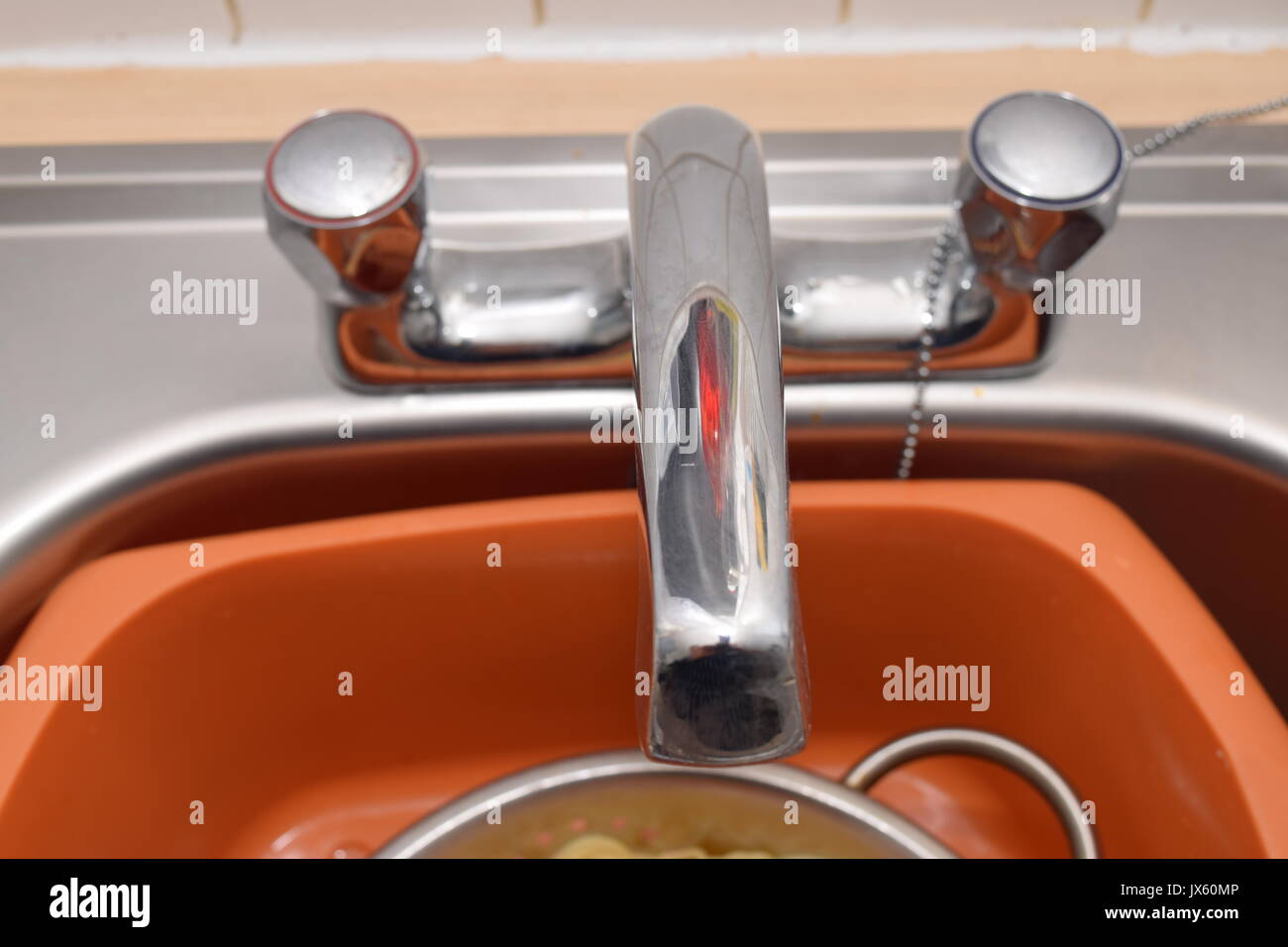 Silver kitchen tap Stock Photo - Alamy