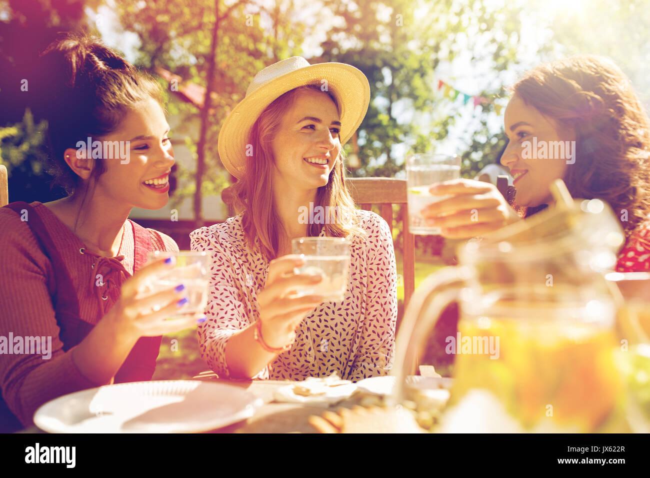 happy friends having party at summer garden Stock Photo - Alamy