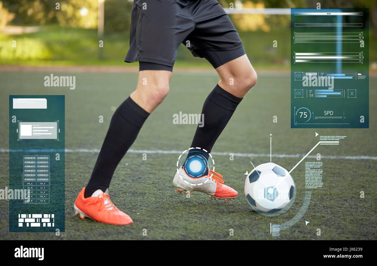 soccer player playing with ball on football field Stock Photo - Alamy