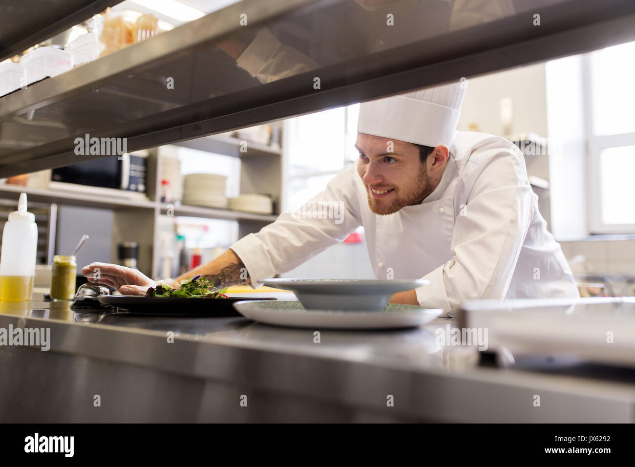 happy male chef cooking food at restaurant kitchen Stock Photo - Alamy
