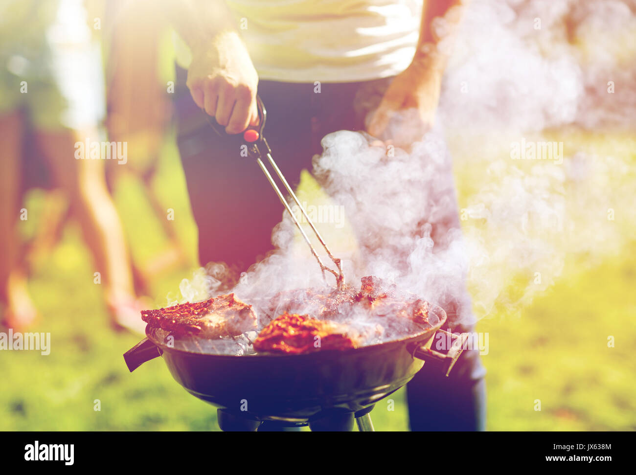 Man and meat and dinner party hi-res stock photography and images - Alamy
