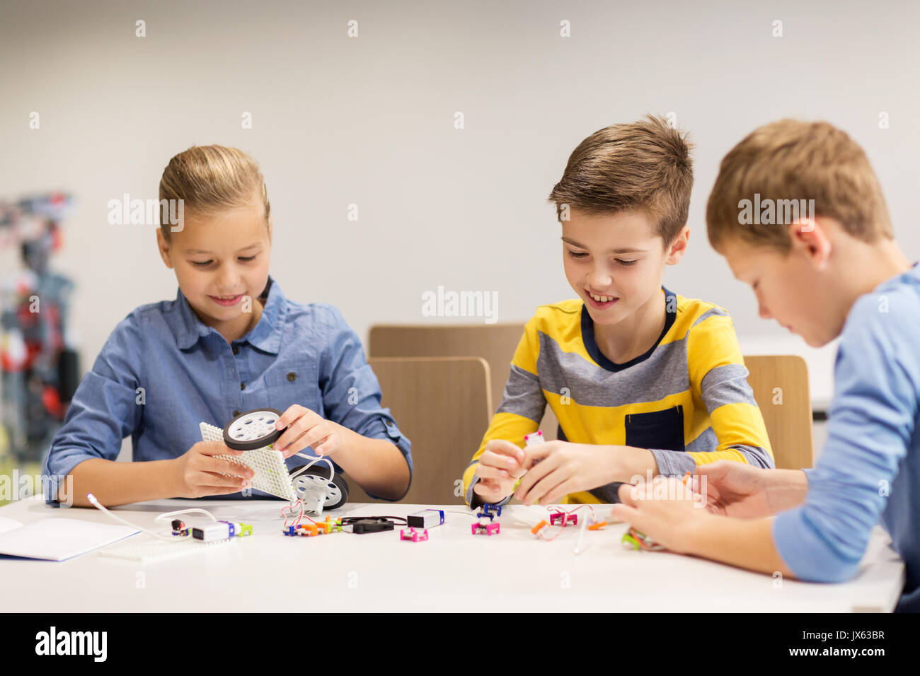 happy children building robots at robotics school Stock Photo - Alamy