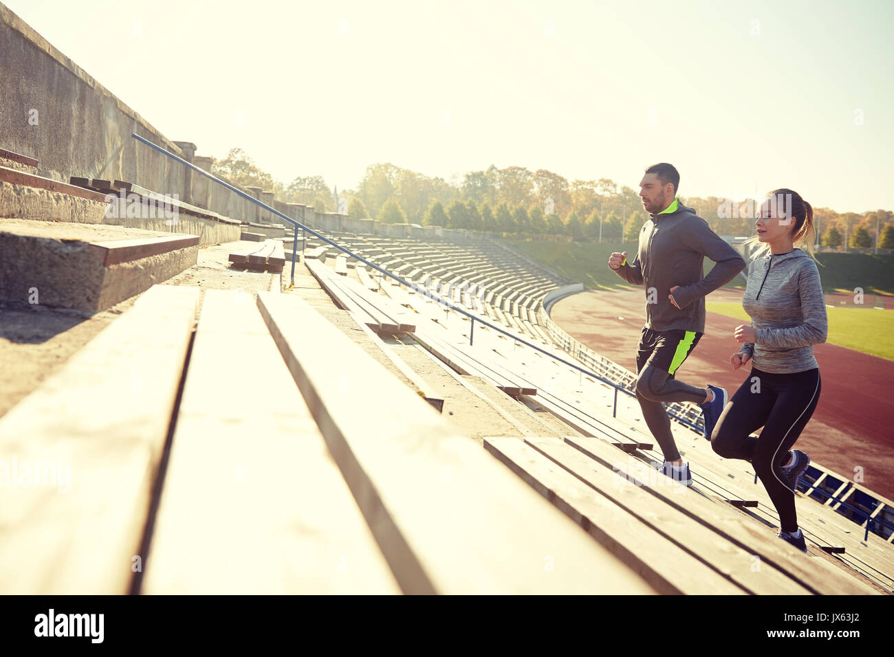 Woman running on stadium track hi-res stock photography and images - Alamy