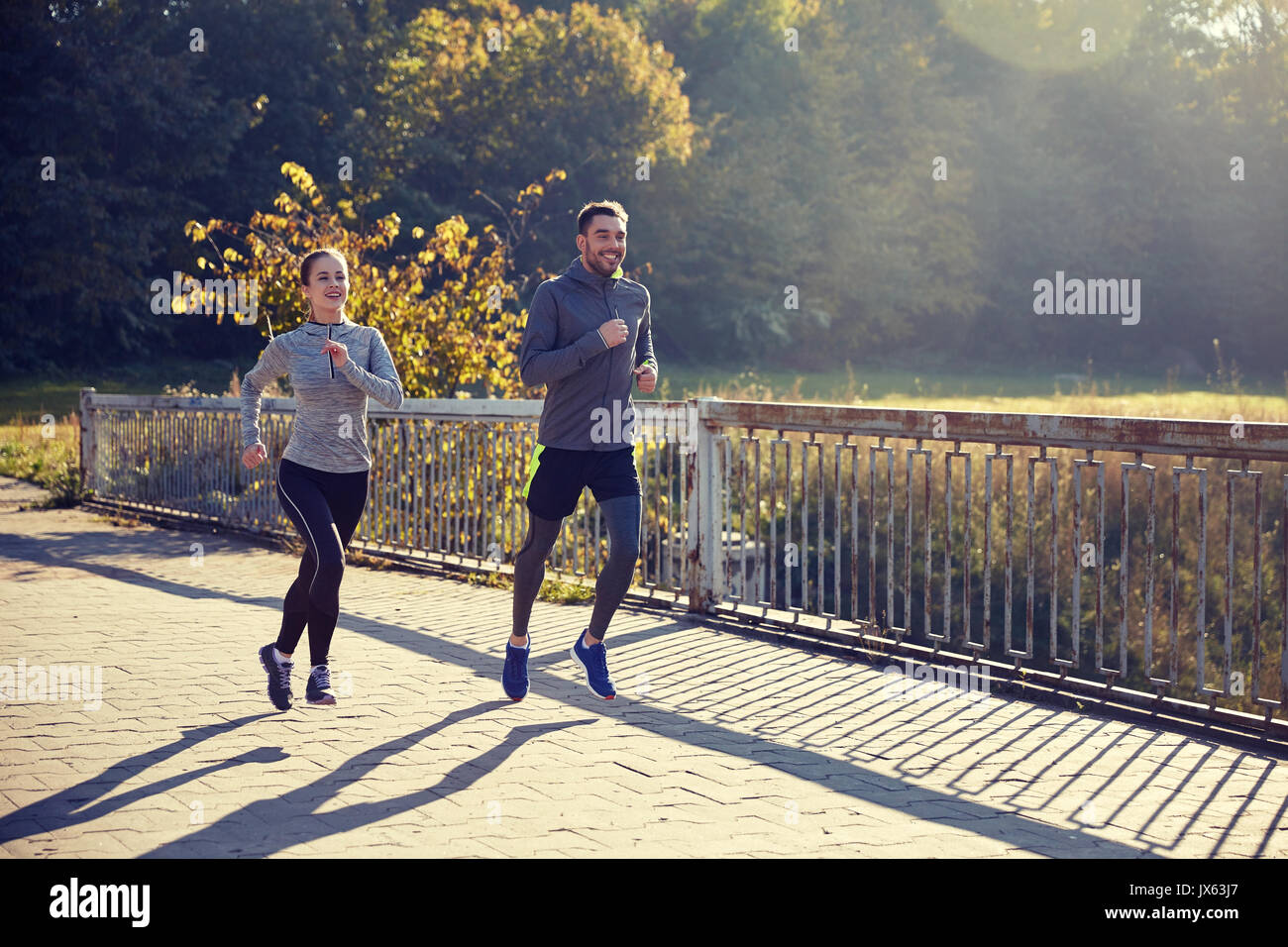 Happy couple runner road hi-res stock photography and images - Alamy