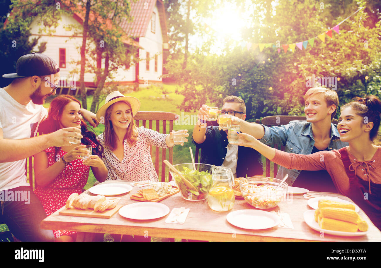 happy friends having party at summer garden Stock Photo - Alamy
