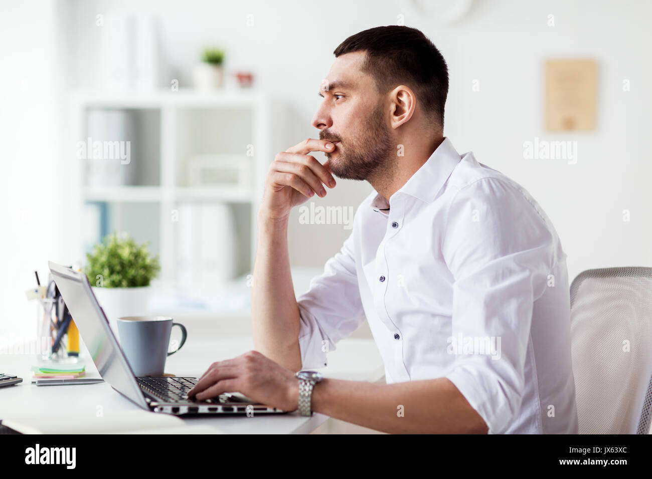 Businessman thinking laptop hi-res stock photography and images - Alamy