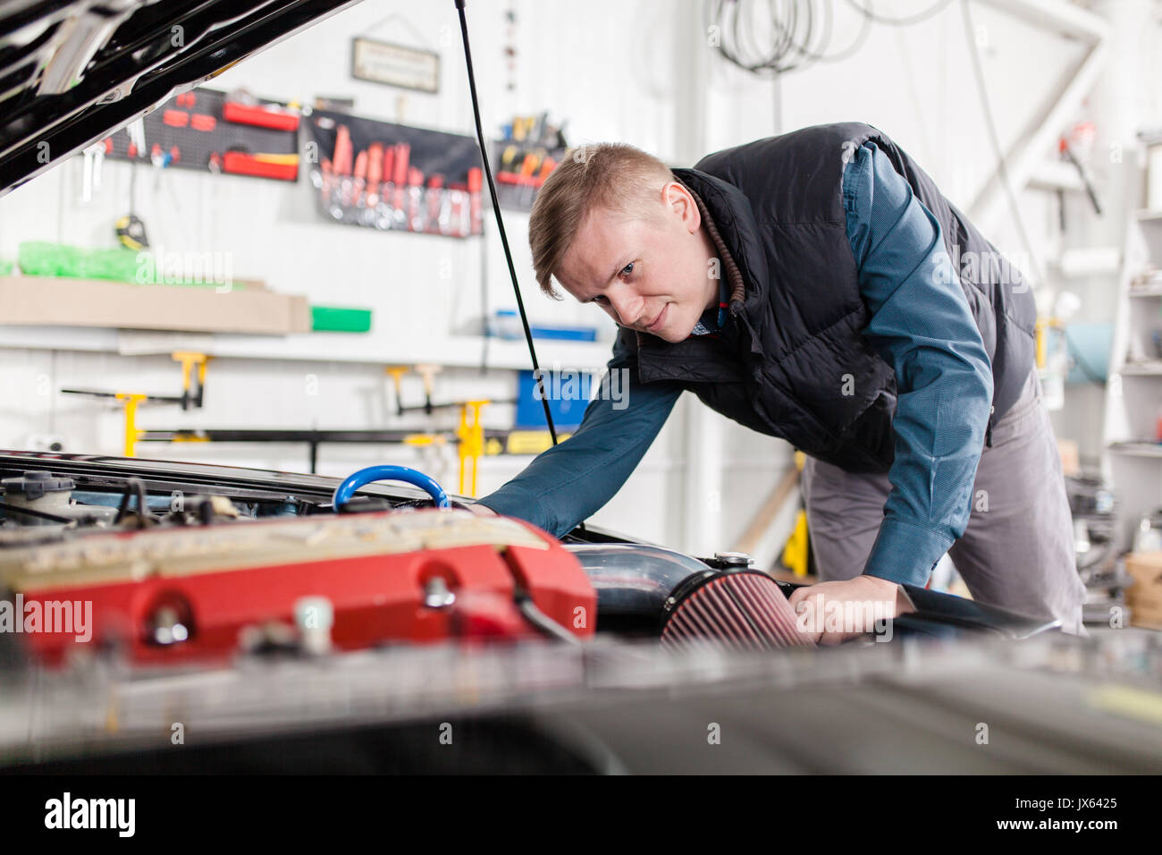 Sports car in a workshop Stock Photo - Alamy