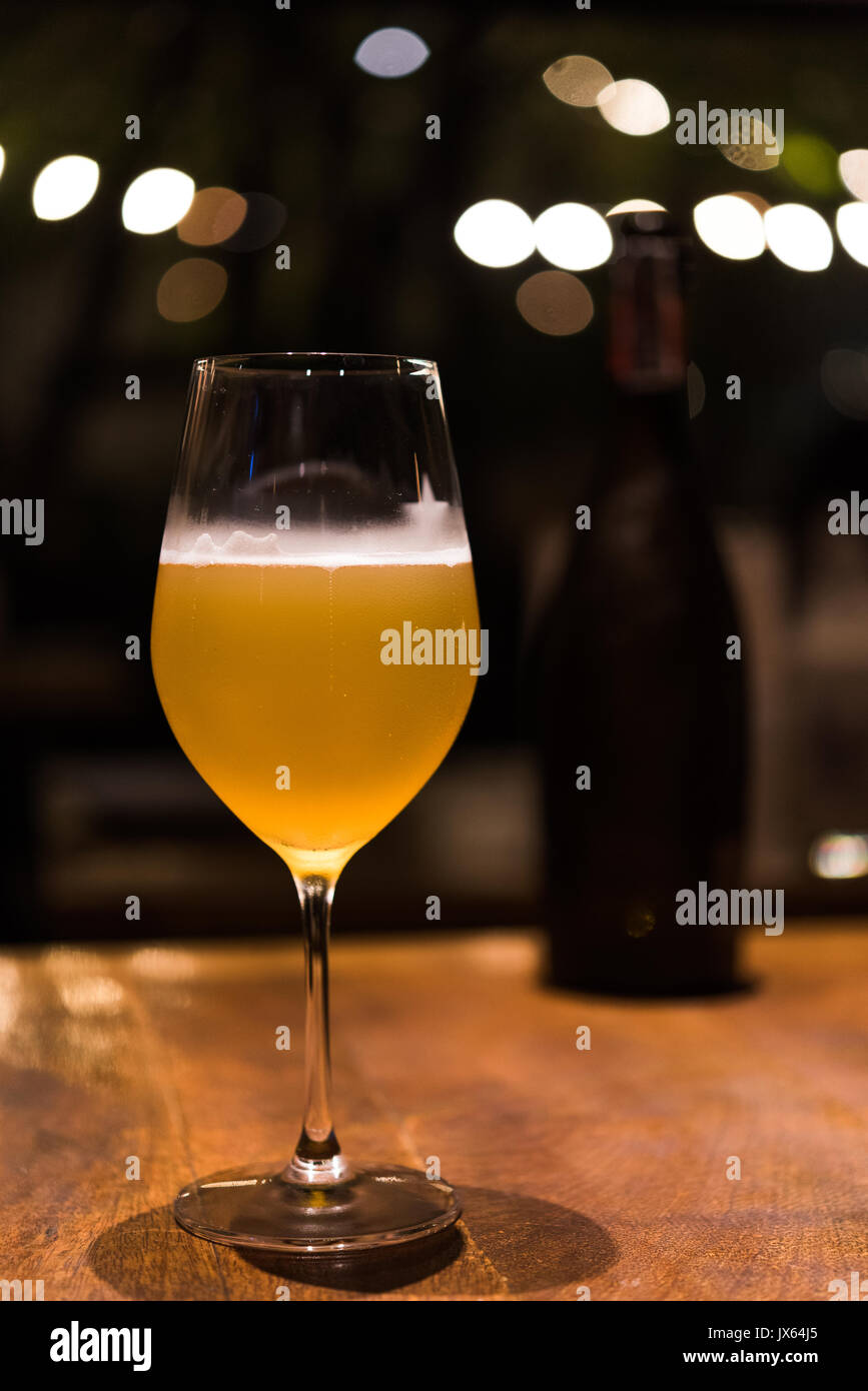 wine glass of beer at relax moment in restaurant at night time Stock ...