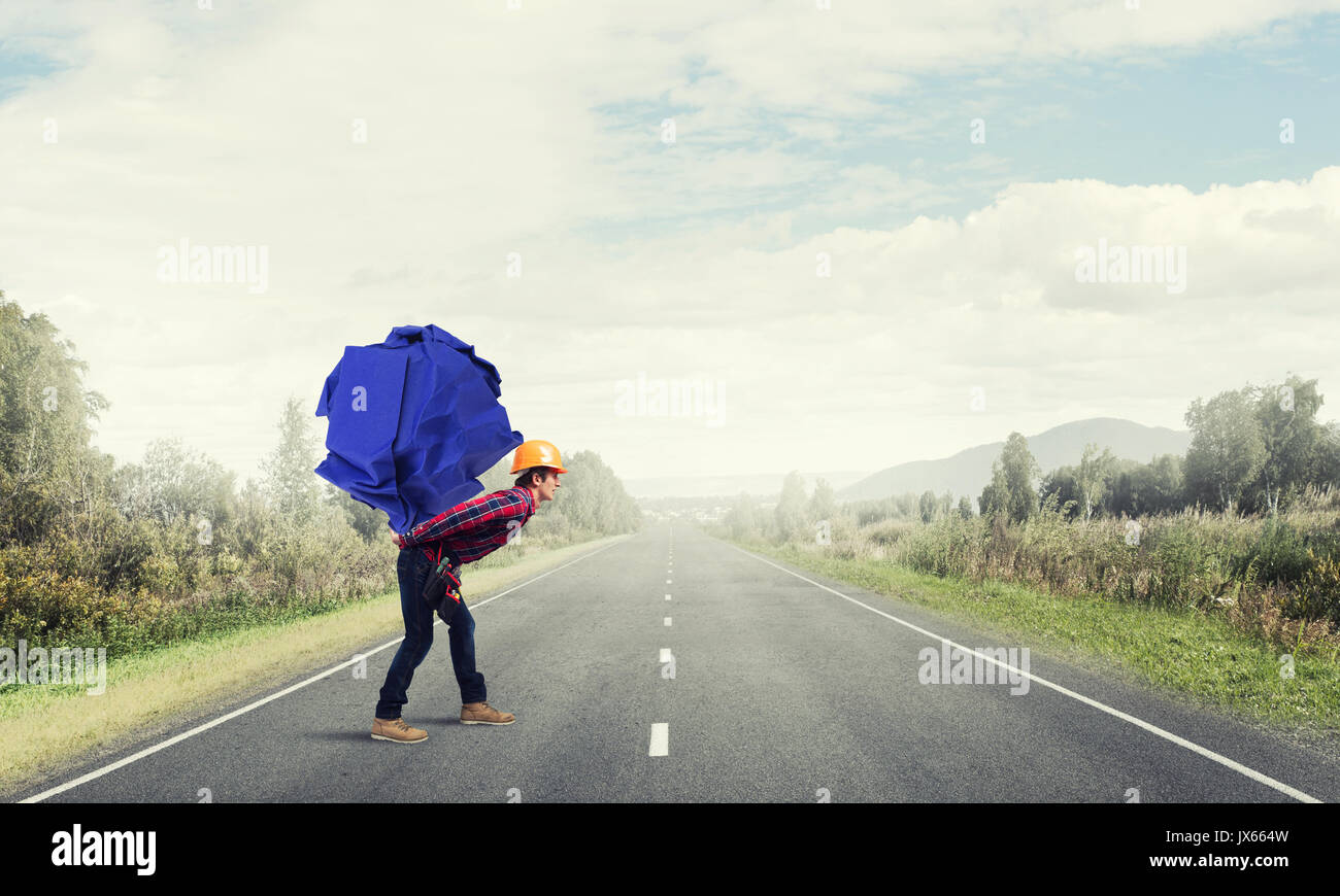 Engineer man carry load Stock Photo - Alamy