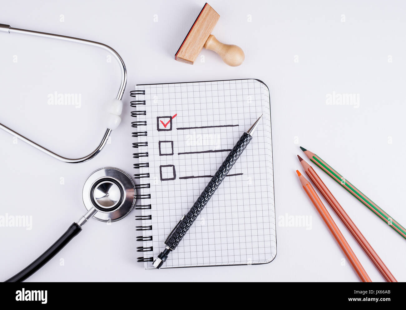 Book with blank checklist on a white office desk Stock Photo - Alamy
