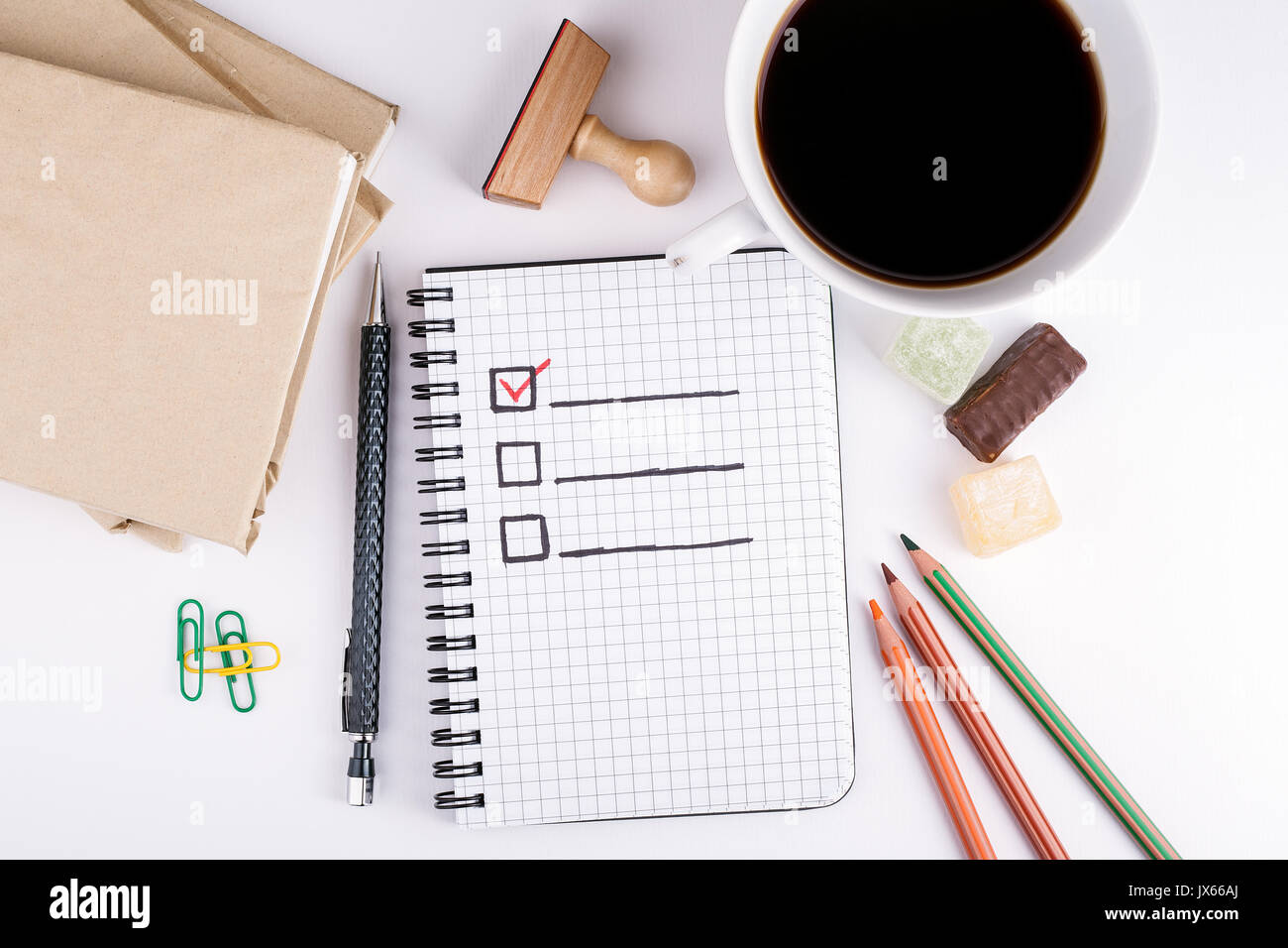 Book with blank checklist on a white office desk Stock Photo - Alamy