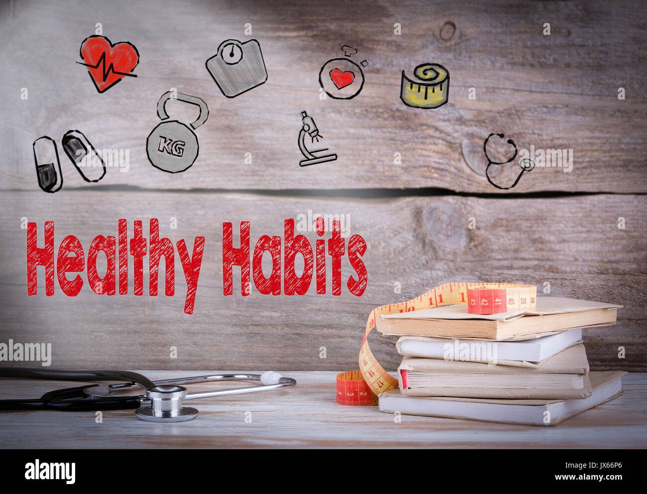 Healthy habits Concept. Stack of books and a stethoscope on a wooden ...