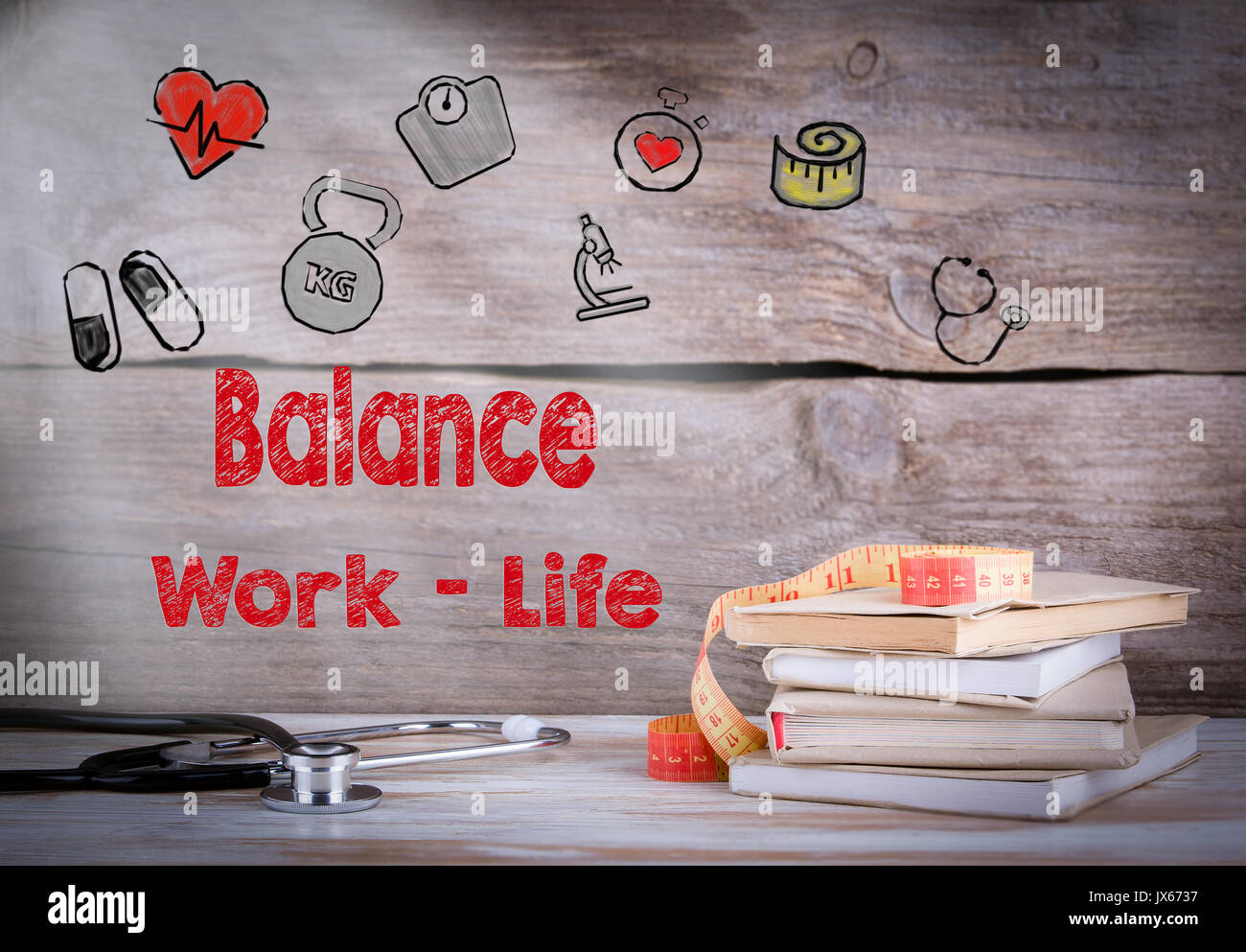 Work Life Balance Concept. Stack of books and a stethoscope on a wooden ...