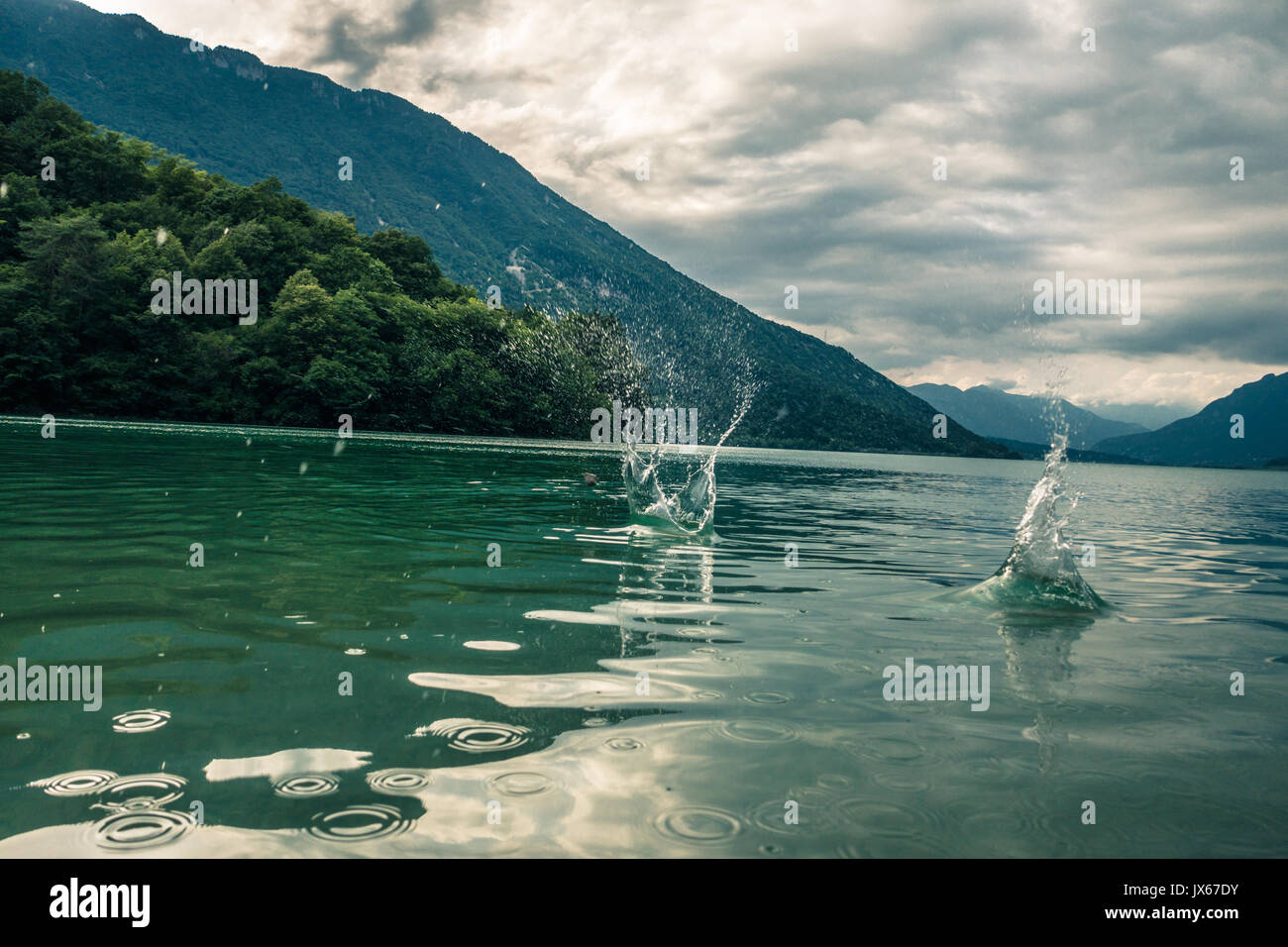 Rock bouncing on water Stock Photo - Alamy