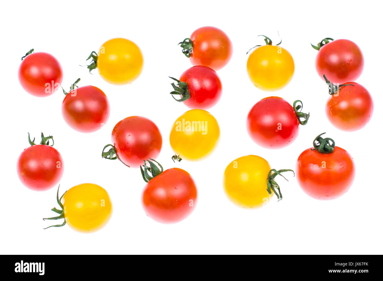 Small colored cherry tomatoes on white background. Studio Photo Stock ...