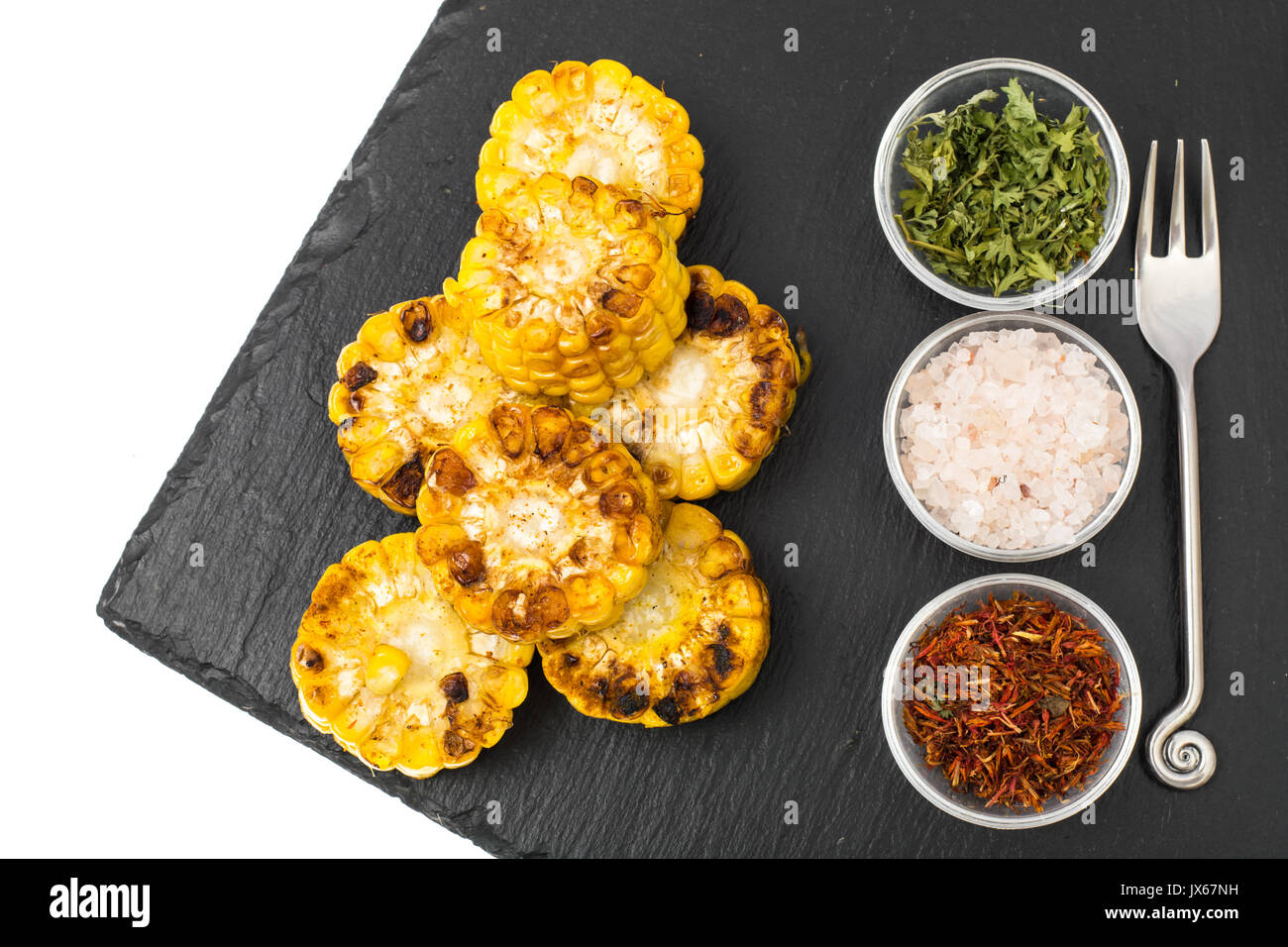 Spicy corn grill on black stone. Studio Photo Stock Photo - Alamy