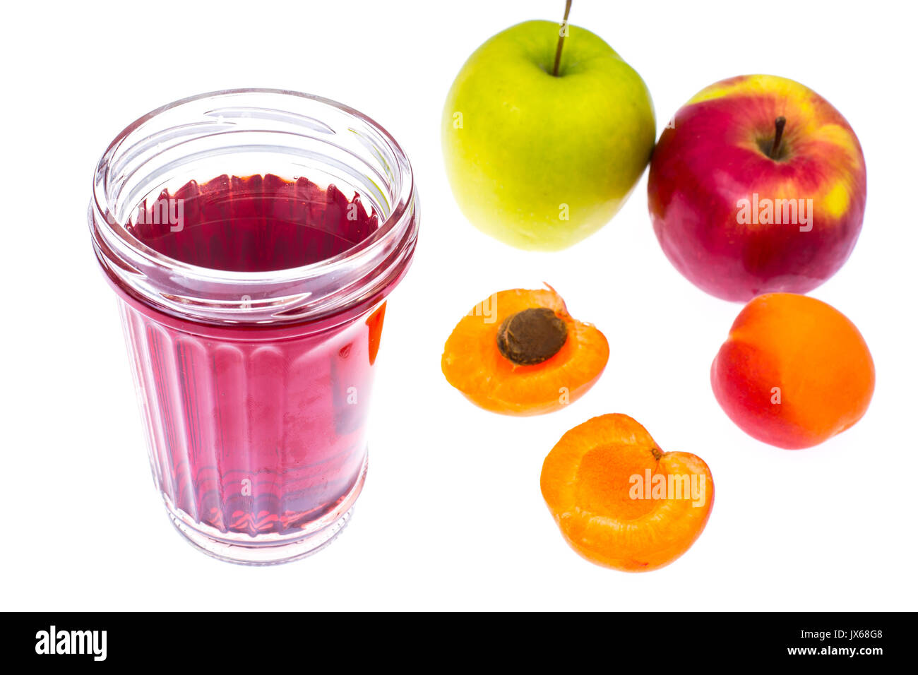 Juice in glass beaker and fresh fruit. Studio Photo Stock Photo - Alamy
