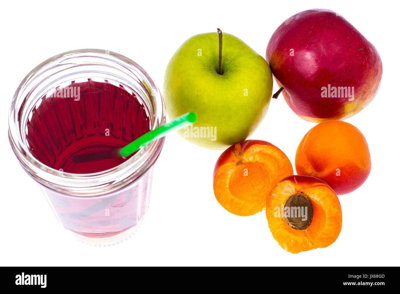 Juice in glass beaker and fresh fruit. Studio Photo Stock Photo - Alamy