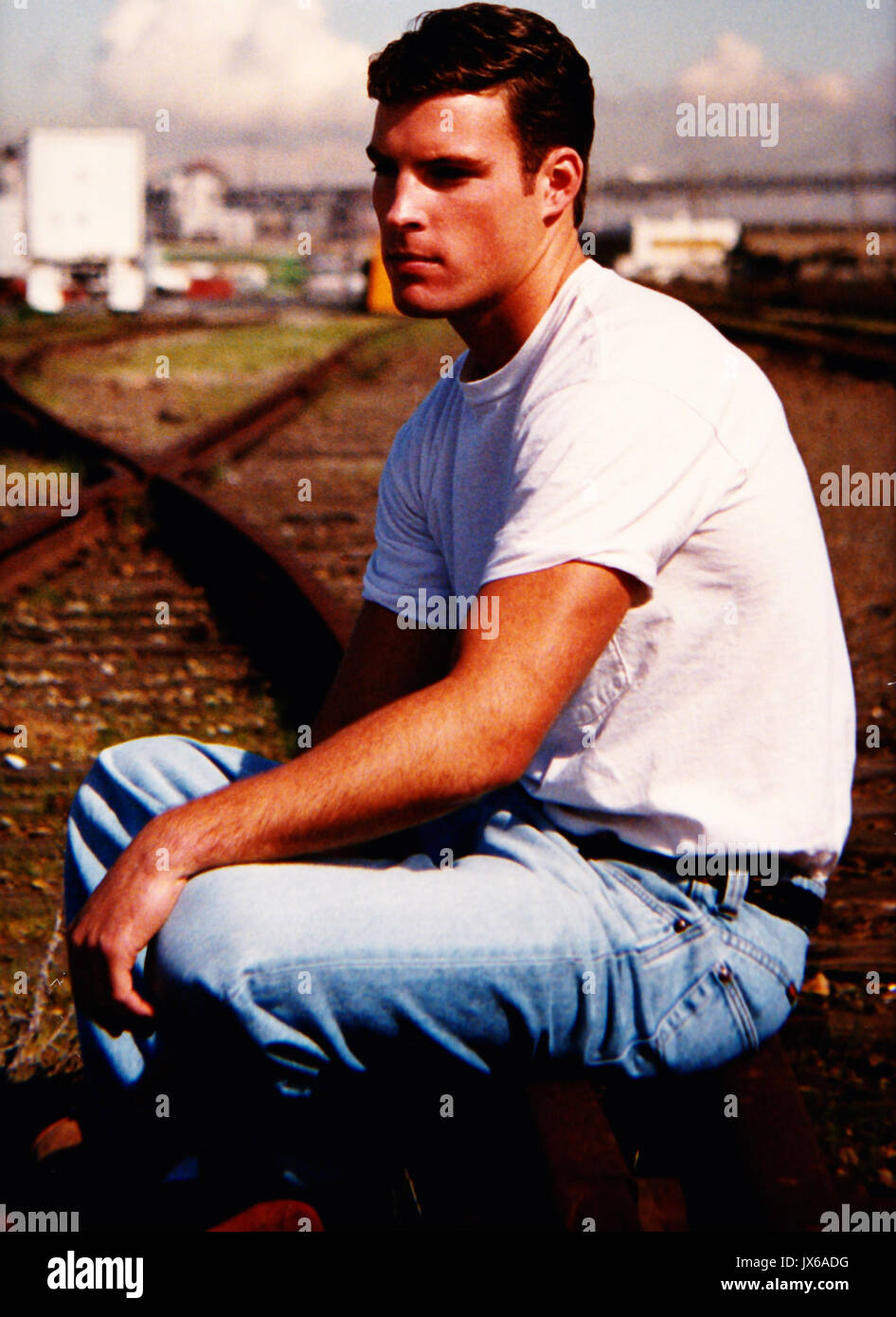 Male Model in Jeans and T-shirt Stock Photo - Alamy