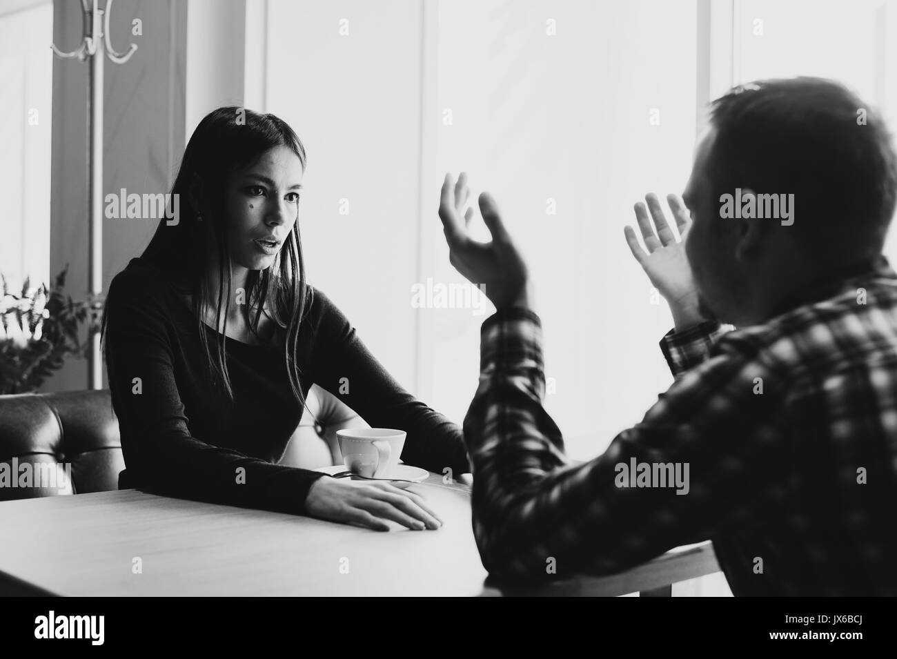 Young couple arguing in a cafe. Relationship problems Stock Photo - Alamy