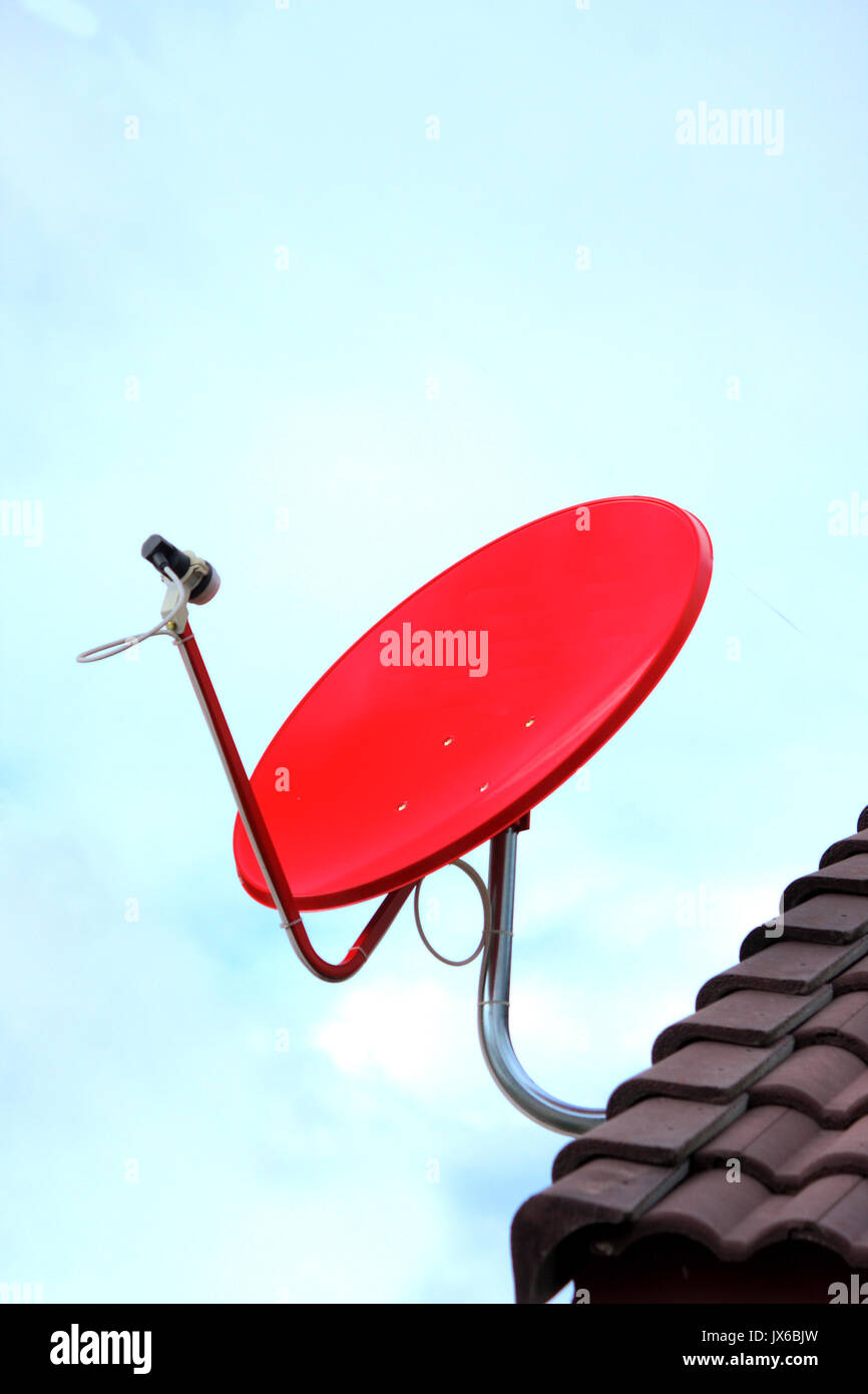 red satellite on roof Stock Photo - Alamy