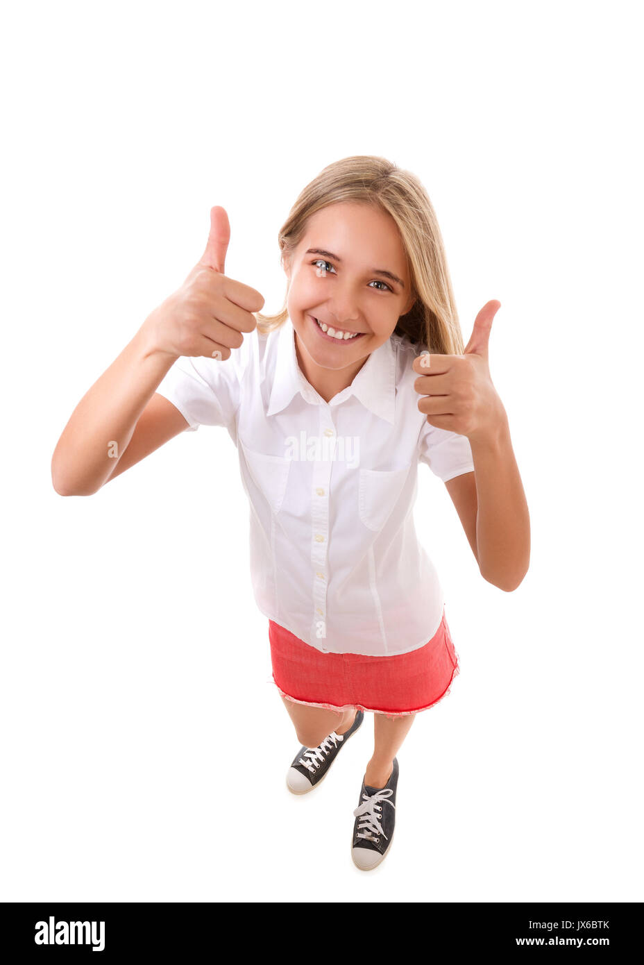 Fun high angle full body portrait of teenage girl shows thumb up ...