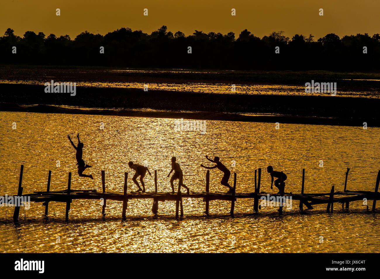 Boy jumping into pond hi-res stock photography and images - Alamy