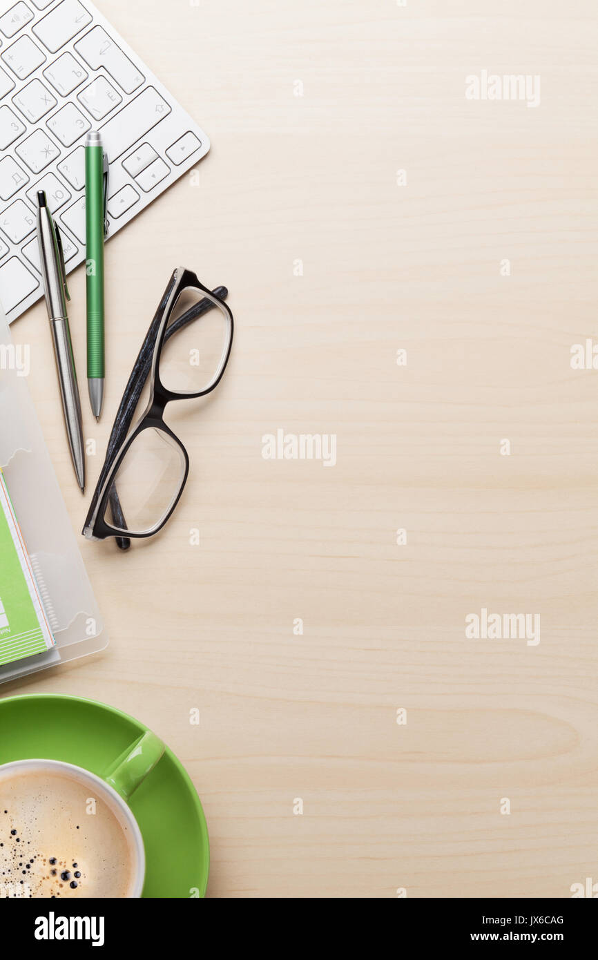 Wooden office desk with computer, coffee and supplies. Tabletop. Top ...