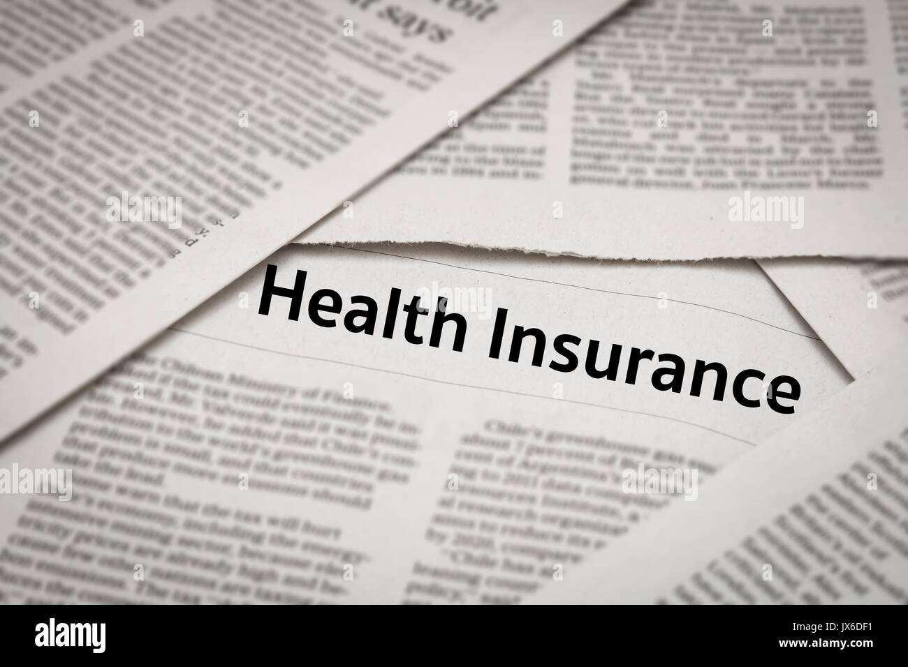 health insurance headline on newspaper Stock Photo - Alamy