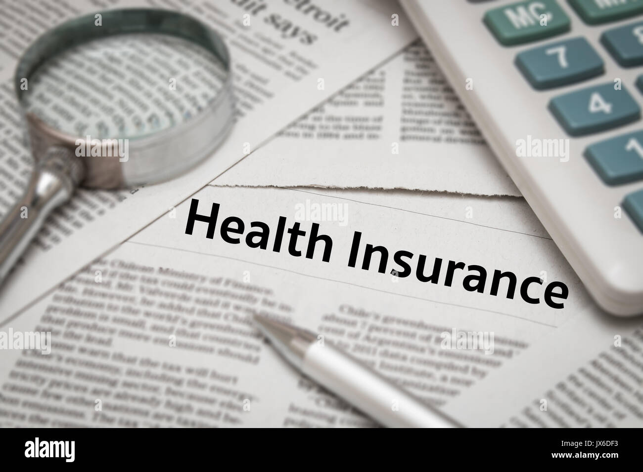 health insurance headline on newspaper Stock Photo - Alamy