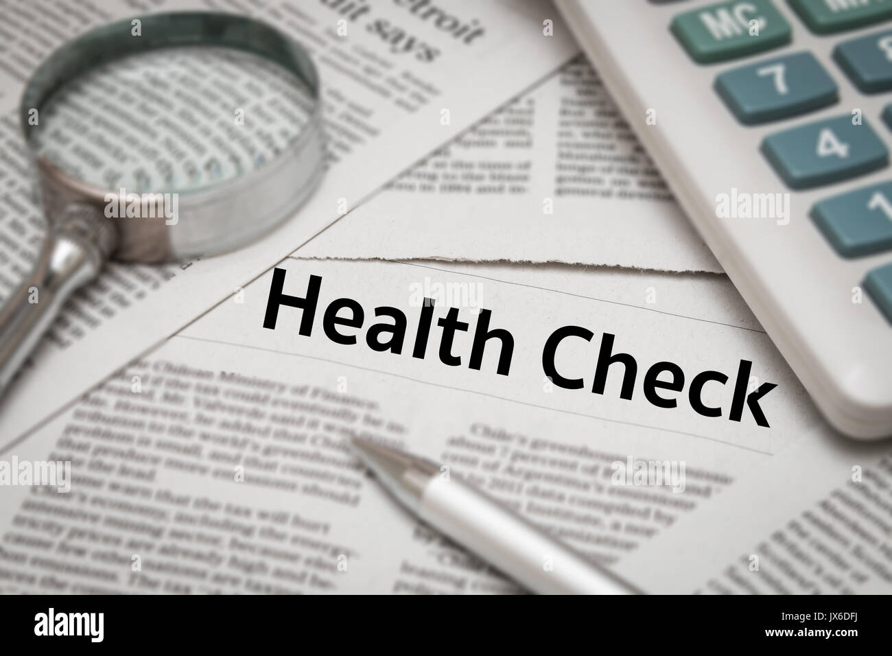 health check headline on newspaper Stock Photo - Alamy