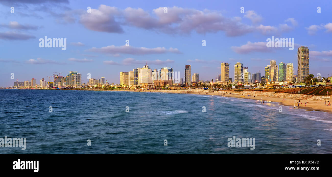 Modern skyline and sand beaches of Tel Aviv city on sunset, Israel ...