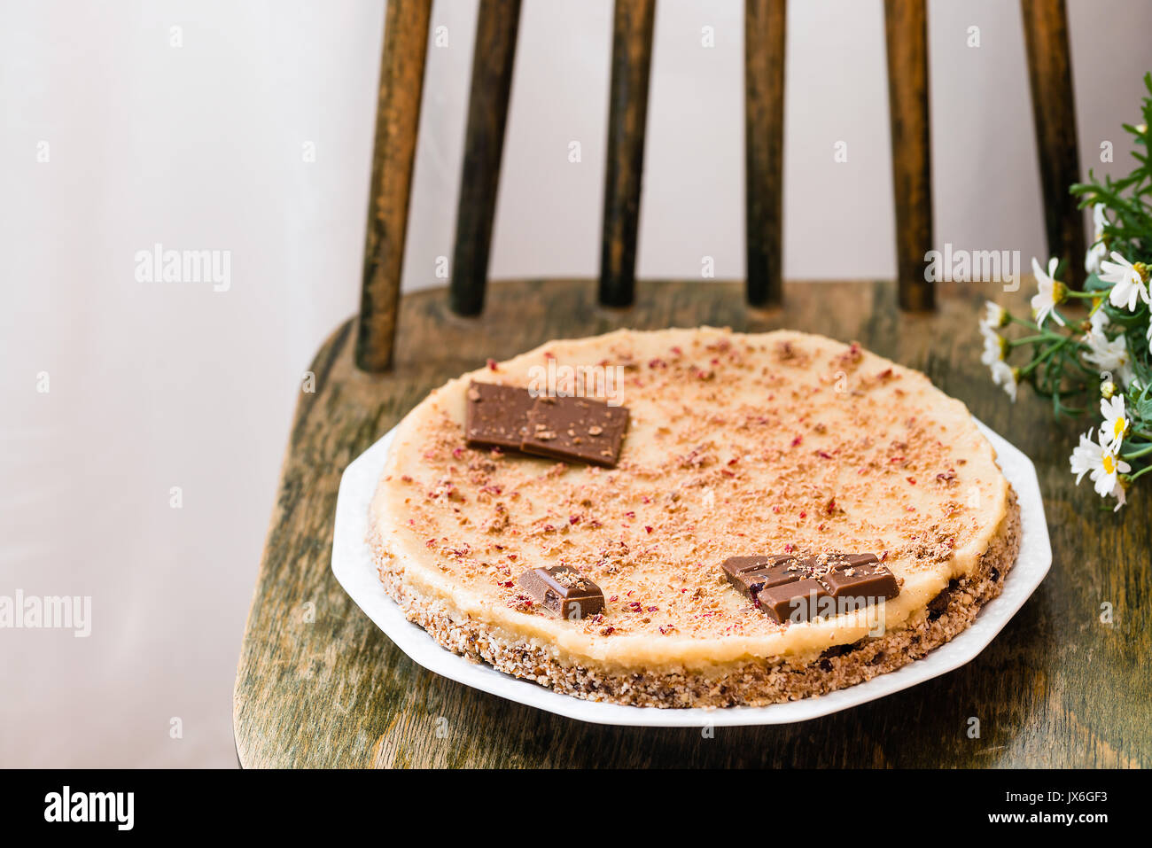 Raw vegan sweet caramel cake made of carob with cashew cream topped ...