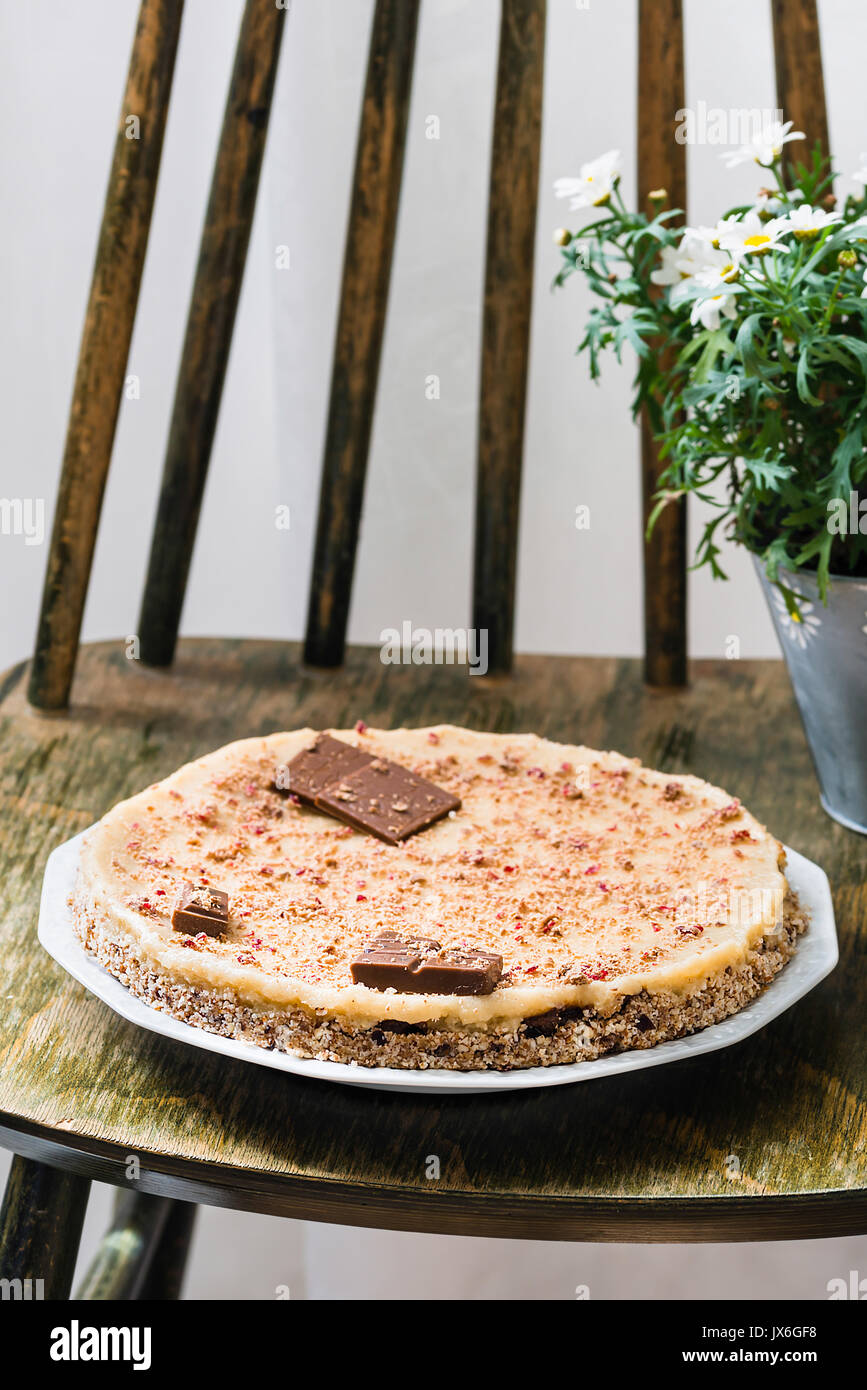 Raw vegan sweet caramel cake made of carob with cashew cream topped ...