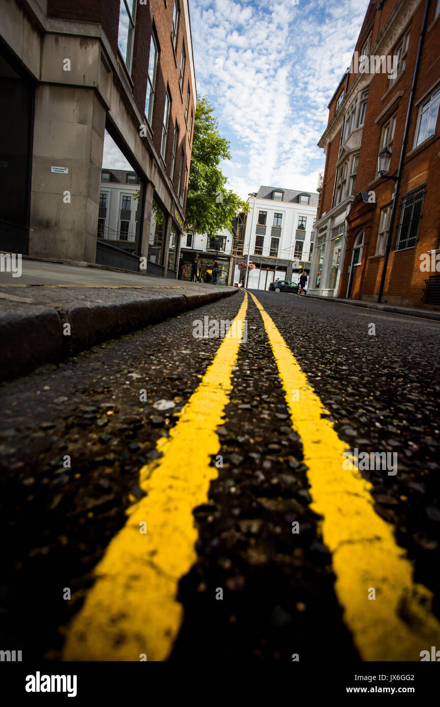 A low Perspective of a Street in London using Double Yellow Lines as a ...