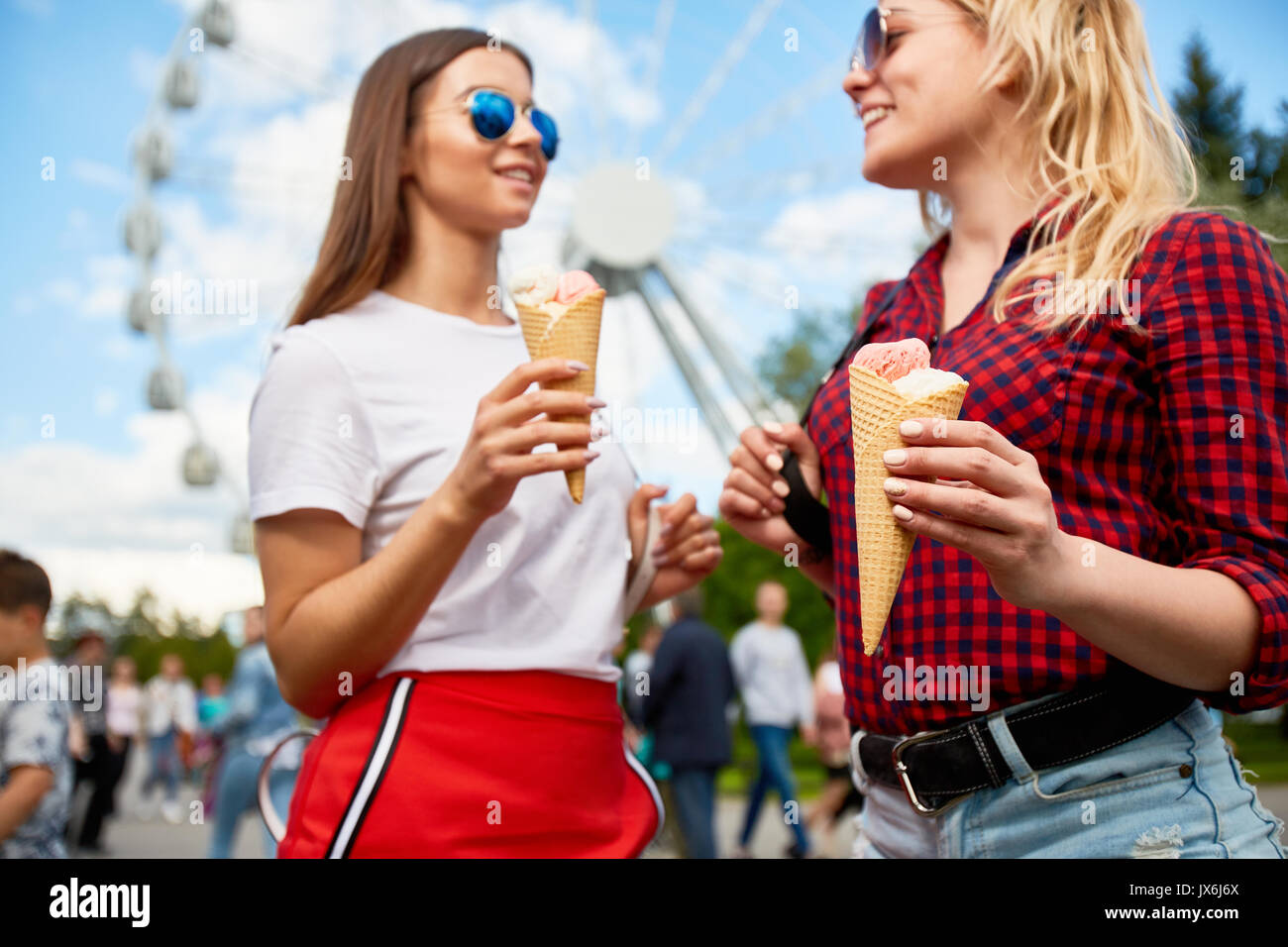 Eating ice-cream in park Stock Photo - Alamy
