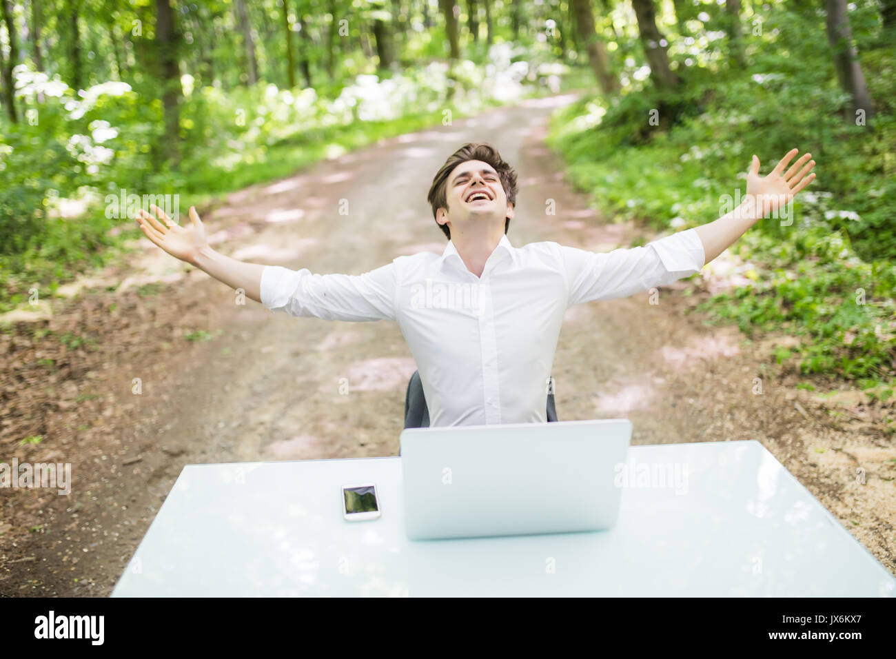 Happy business man with raised hands up celebrate great job or good ...
