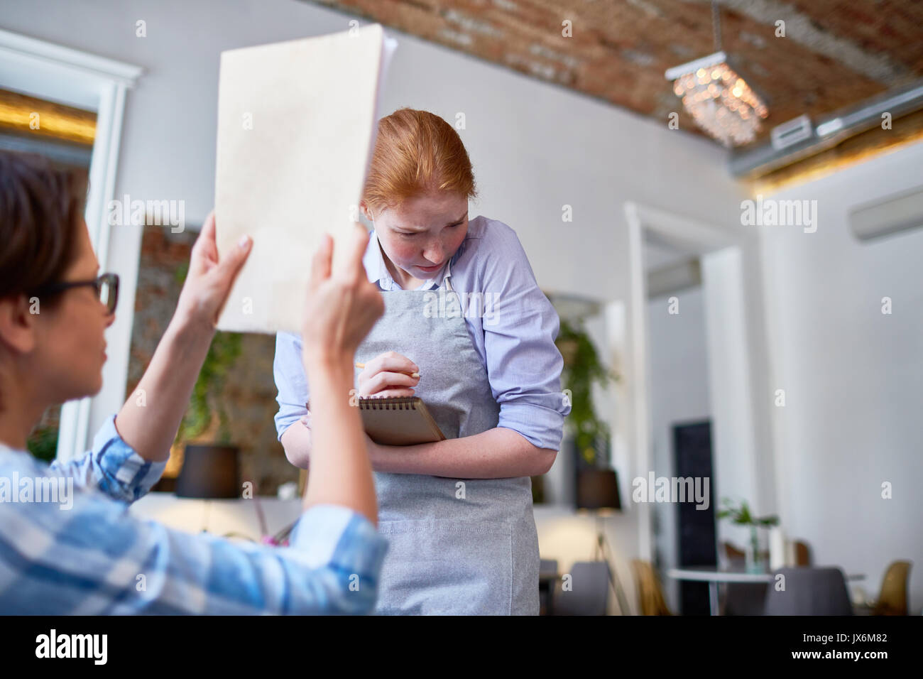 Dissatisfied Restaurant Visitor Criticizing Waitress Stock Photo - Alamy