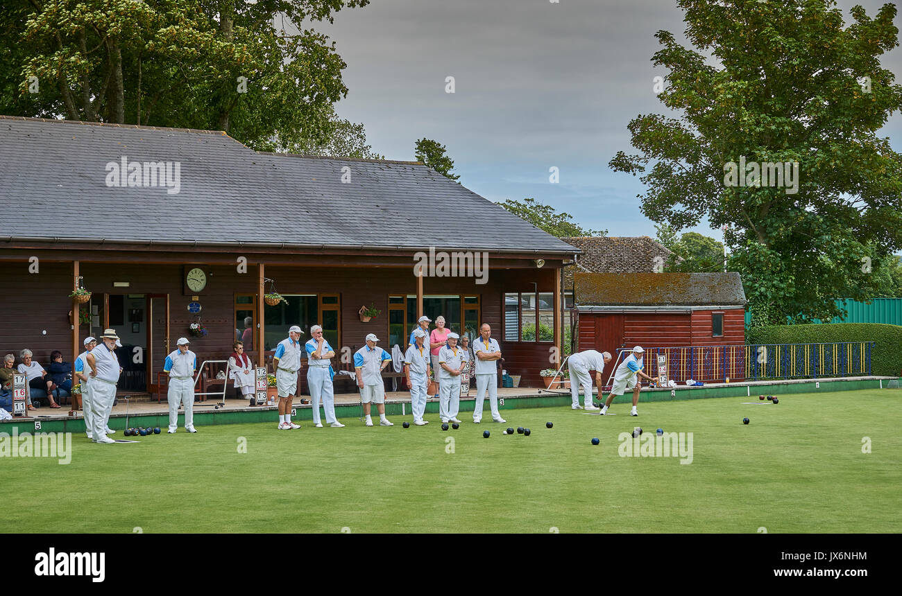 Teams of retired people playing bowls on a bowling green Stock Photo ...
