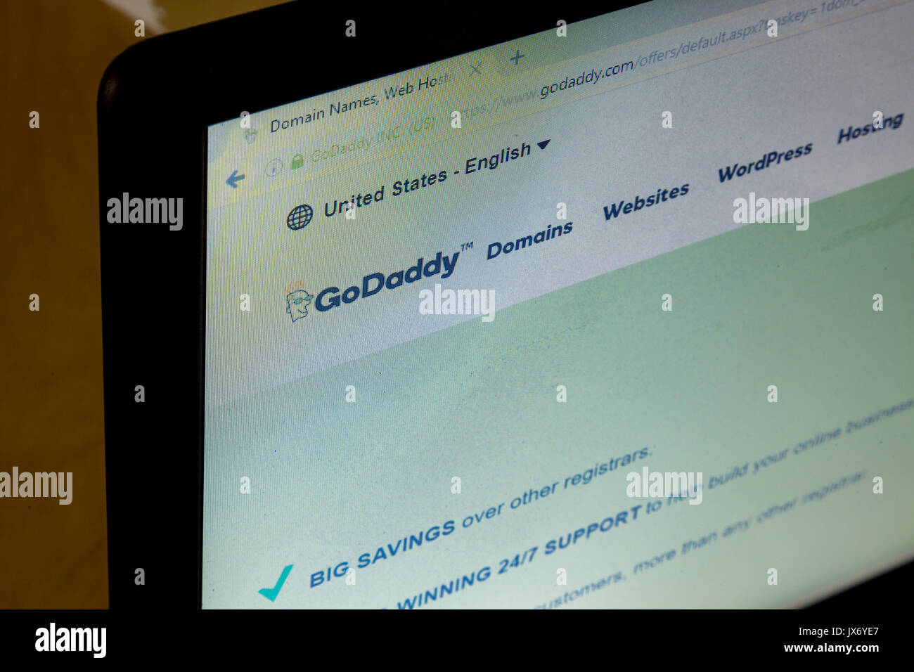 GoDaddy Inc. logo on its website is shown on a laptop computer screen ...