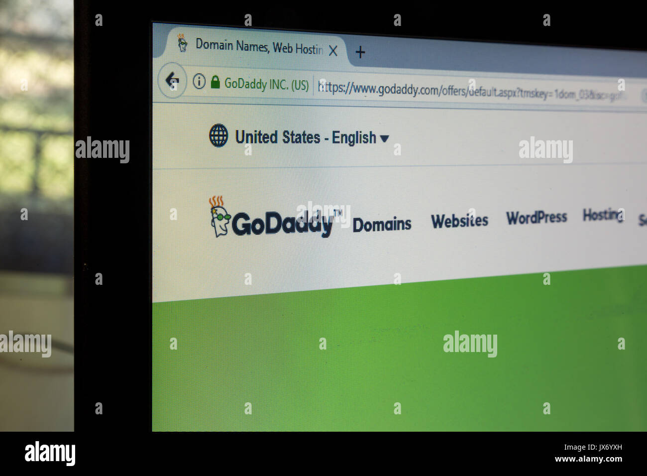 GoDaddy Inc. logo on its website is shown on a laptop computer screen ...