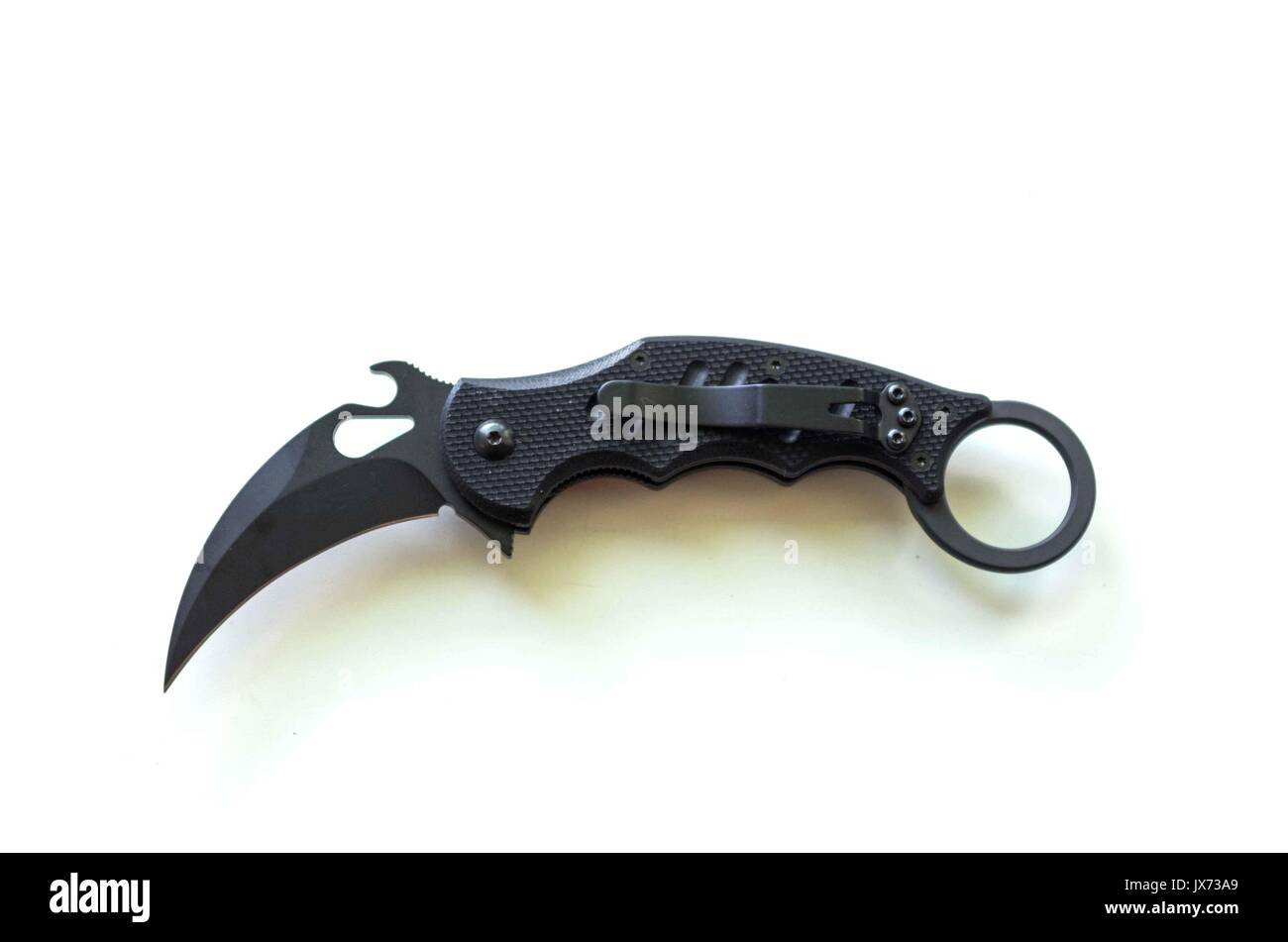 Black knife military in the form of a claws, beak, hook. Knife in the ...