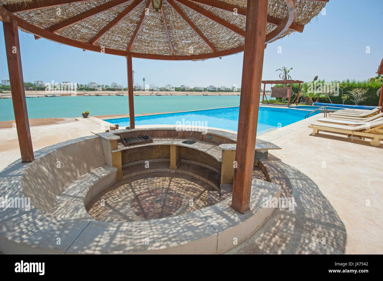 Luxury villa show home in tropical summer holiday resort with swimming ...