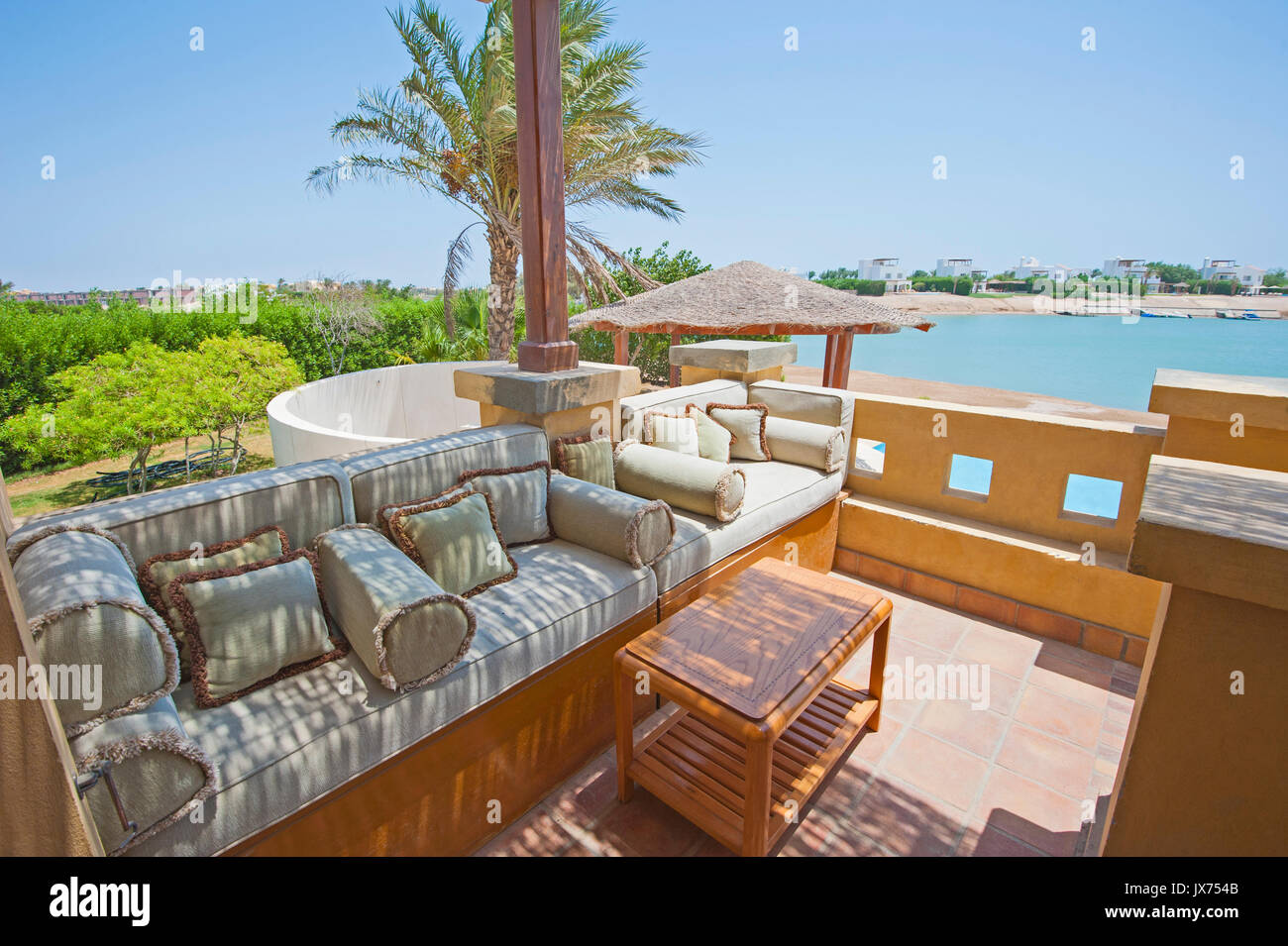 Terrace furniture of a luxury villa in tropical resort with chairs and ...