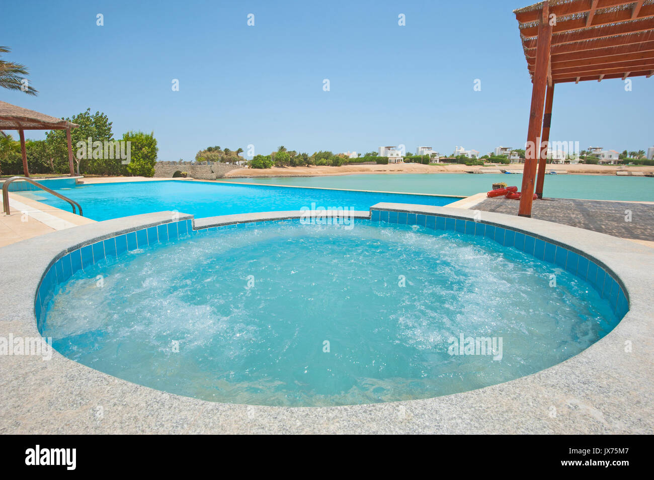 Luxury villa show home in tropical summer holiday resort with swimming ...