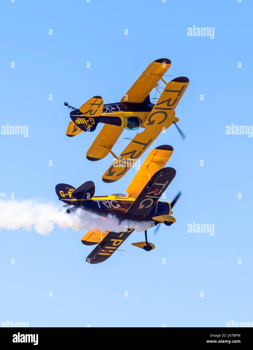 Trig Aerobatic Team performing close-formation aerobatic stunts in ...